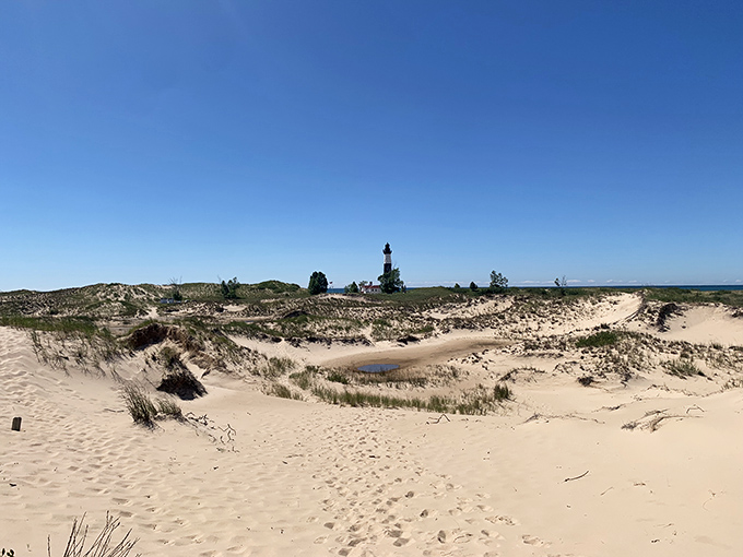 Like a mirage rising from the dunes, Big Sable appears in the distance, rewarding hikers with their first glimpse of the prize.