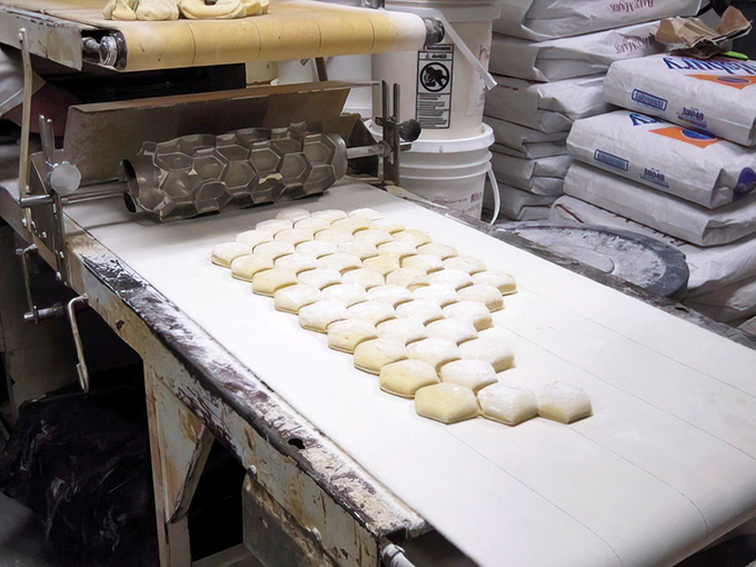 The production line where magic happens. Each square of dough holds the promise of becoming someone's highlight of the day.