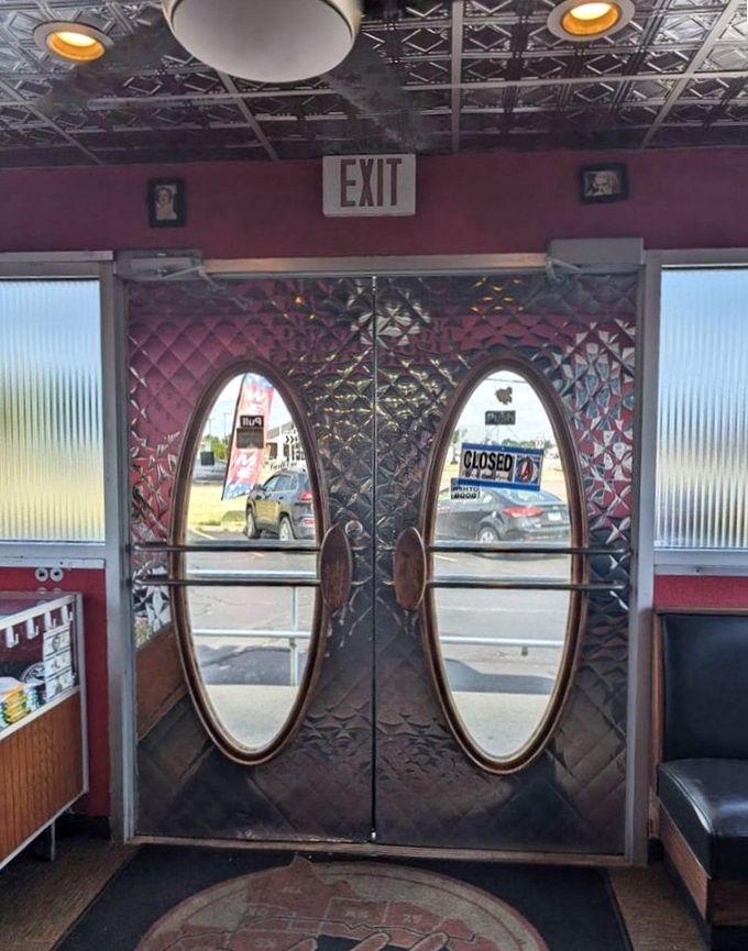 Those iconic oval doors aren't just entrances &ndash; they're time portals to an era when diners ruled American roadways. Pure mid-century magnificence.