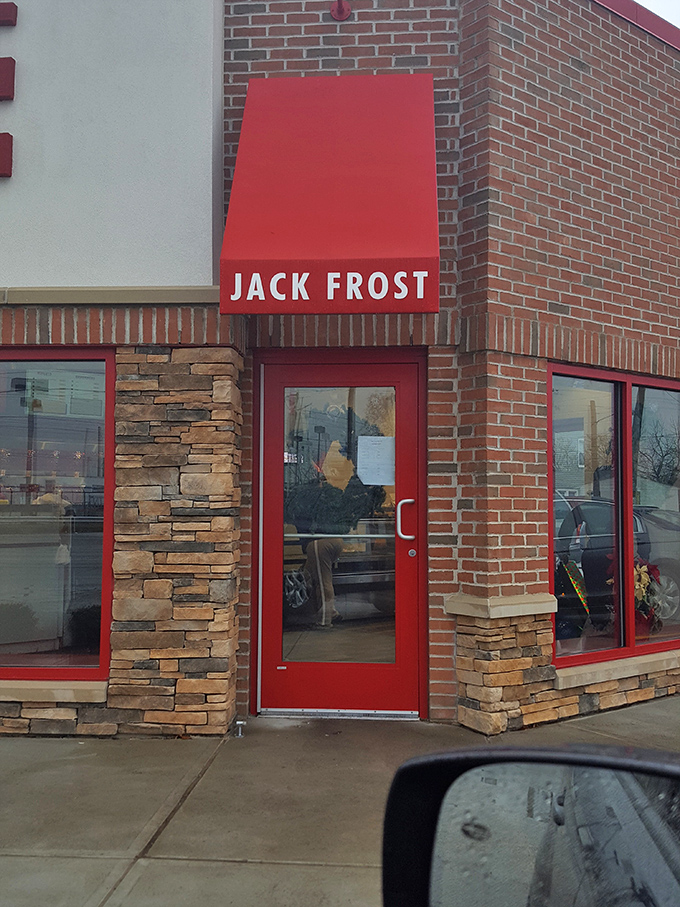 The red door beckons like a portal to a parallel universe where calories don't count and sugar is a food group.