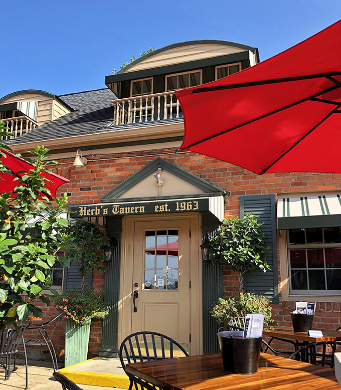 The entrance to Herb's Tavern isn't just a door&mdash;it's a portal to comfort food nirvana, framed by brick and greenery that whispers, "Come on in."