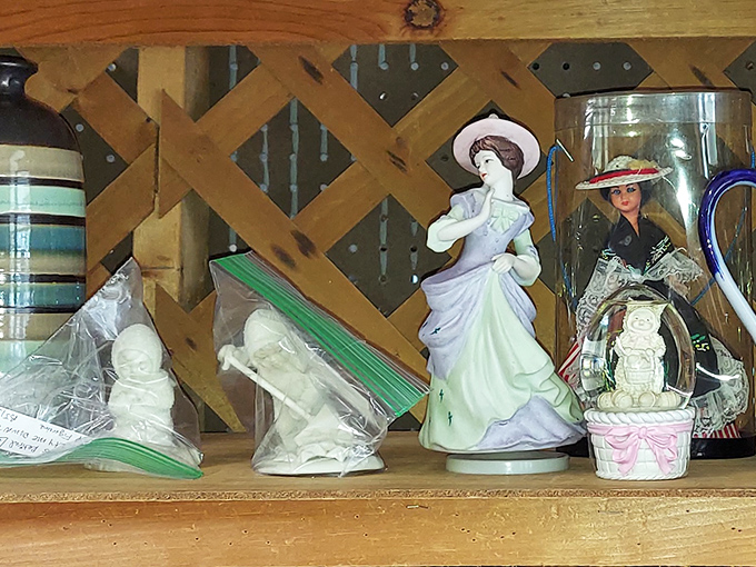Porcelain figurines pose delicately on wooden shelves, frozen in eternal grace from an era when mantels were stages for miniature elegance.
