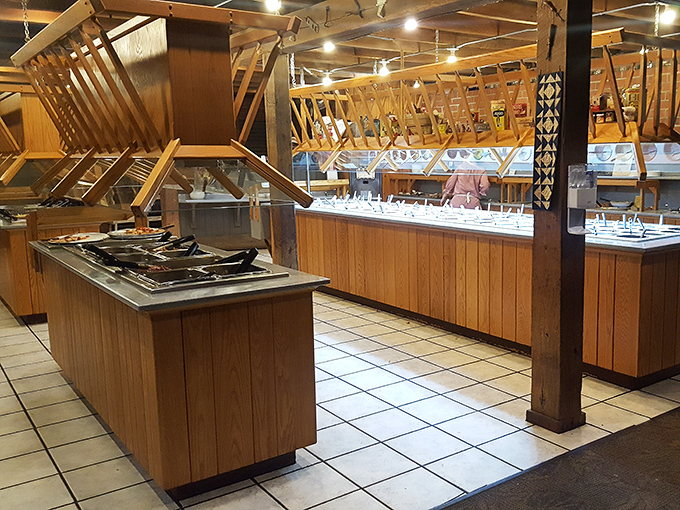 The buffet setup isn't just efficient – it's a masterclass in Midwestern abundance. Wood paneling and support beams remind you this was once a working barn.