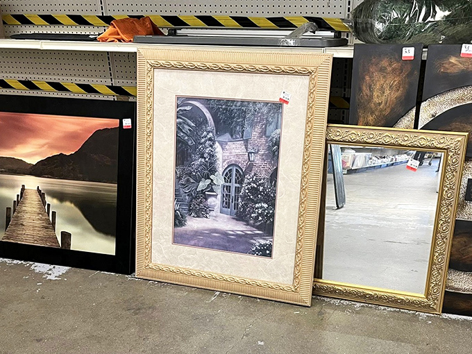 Wall art that ranges from "hotel room chic" to "hidden masterpiece." That ornate gold frame probably costs more new than your first car payment.