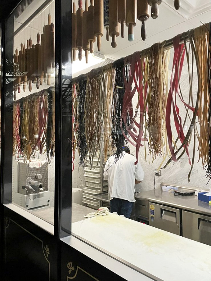 Pasta hanging like edible art&mdash;a behind-the-scenes glimpse at the magic before it meets sauce in a delicious Italian love story.