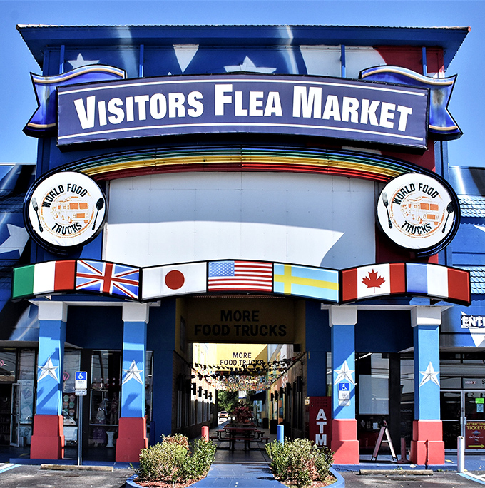 Gateway to retail therapy – the market's entrance promises a world of international treasures with flags that say "your wallet is welcome here."