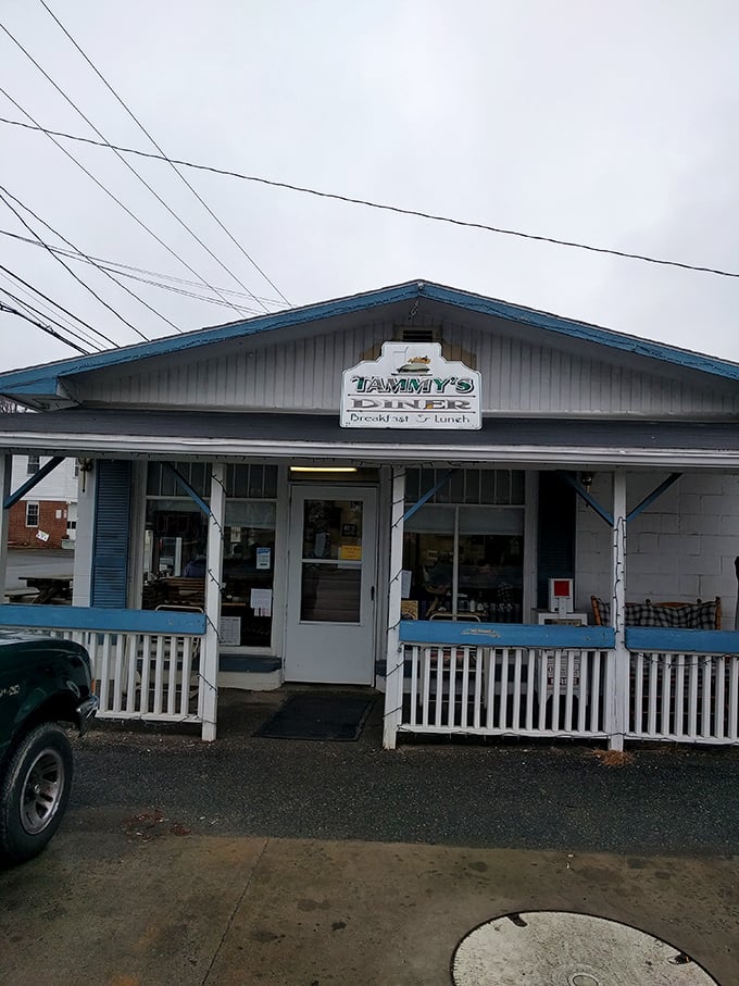 The classic diner facade with its cheerful blue sign promises authentic breakfast experiences waiting inside.