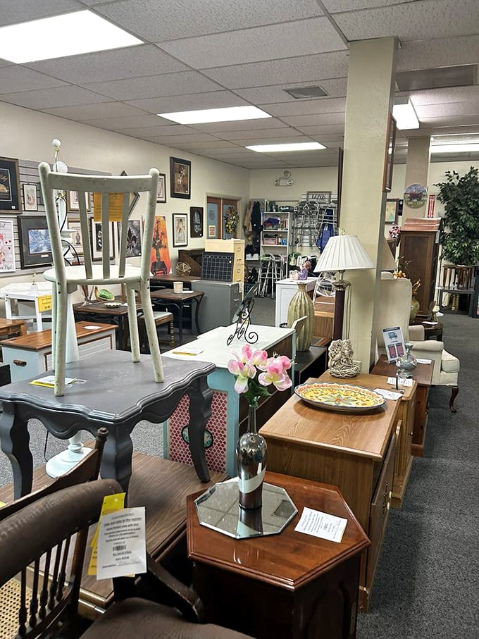 Furniture arranged like a home d&eacute;cor fever dream&mdash;mismatched tables and chairs that somehow make perfect sense in this thrifter's paradise.