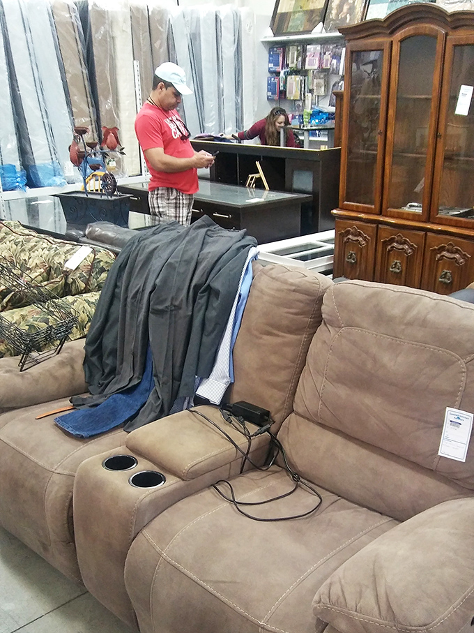 Furniture rehabilitation center where pre-loved pieces wait patiently for homes that appreciate their character and stories.