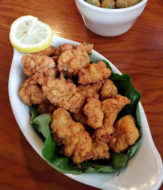 These golden nuggets of gator tail are the reason road trips were invented. Crispy, tender, and served with a squeeze of lemon for perfection.