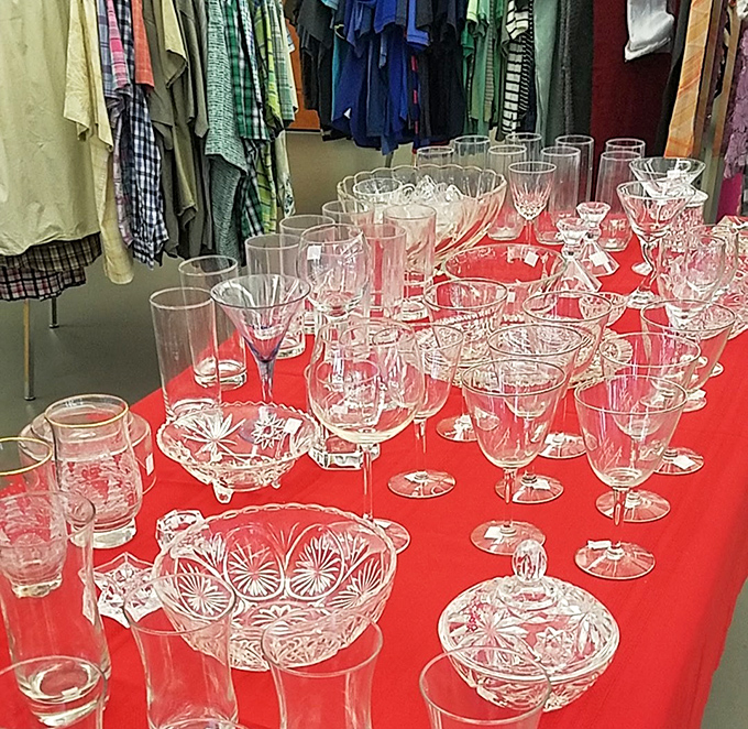 Crystal and glassware displayed like a sophisticated yard sale at Downton Abbey – elegant pieces at prices that would make the Dowager Countess faint.