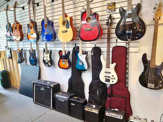 A wall of musical possibility where future rock stars and weekend warriors alike find their next six-string companion at prices that won't break the band.