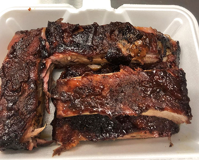 Half rack of ribs that's been slow-dancing with smoke for hours, resulting in a bark so beautiful it deserves its own Instagram account.