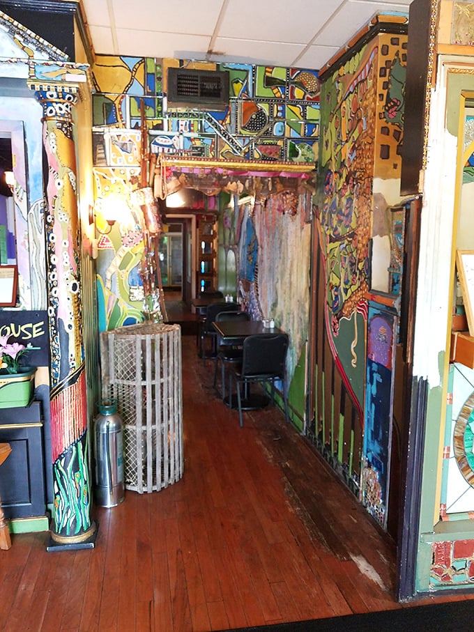 Walking through this hallway is like entering an artistic fever dream. The hand-painted walls tell stories that change depending on your mood.