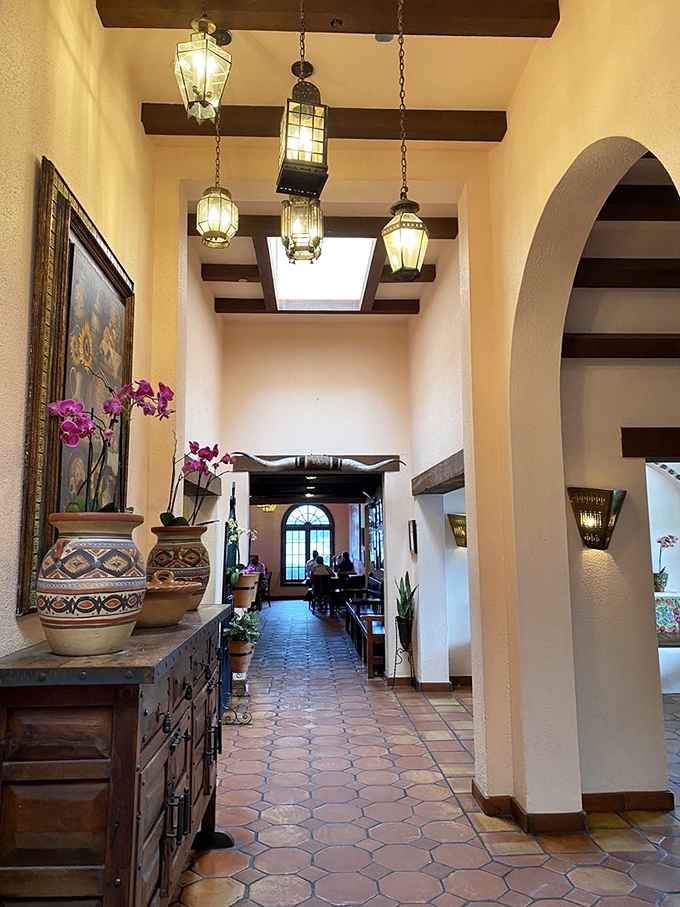 The entryway feels like walking into a well-loved hacienda. Those hanging lanterns have illuminated countless celebrations.