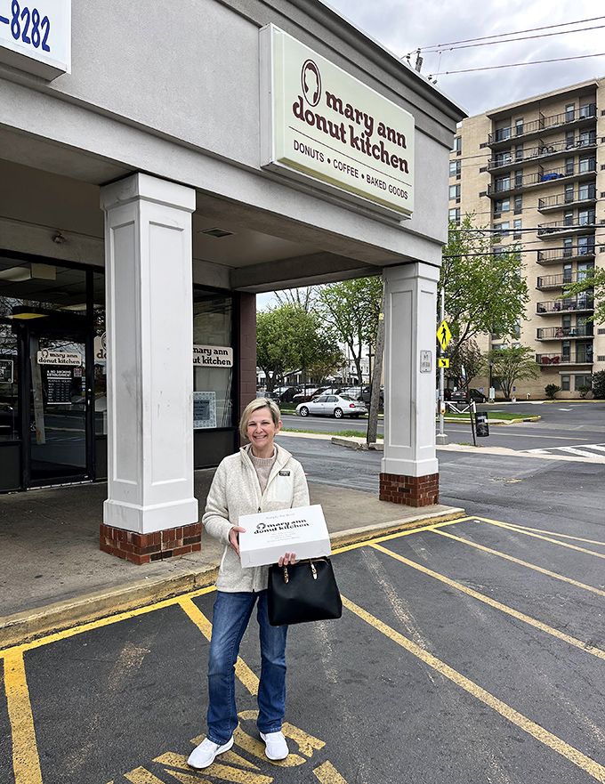 That satisfied smile says everything about the Mary Ann Donut Kitchen experience - pure joy in edible form.
