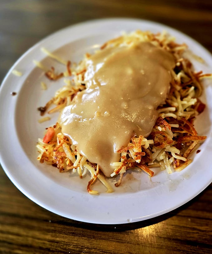 Hash browns smothered in gravy&mdash;because sometimes potatoes need to dress up for the occasion too. 