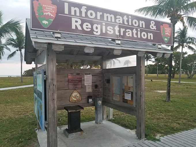 The information kiosk stands as the island's humble concierge, offering guidance without the expectation of tips or the need for reservations.