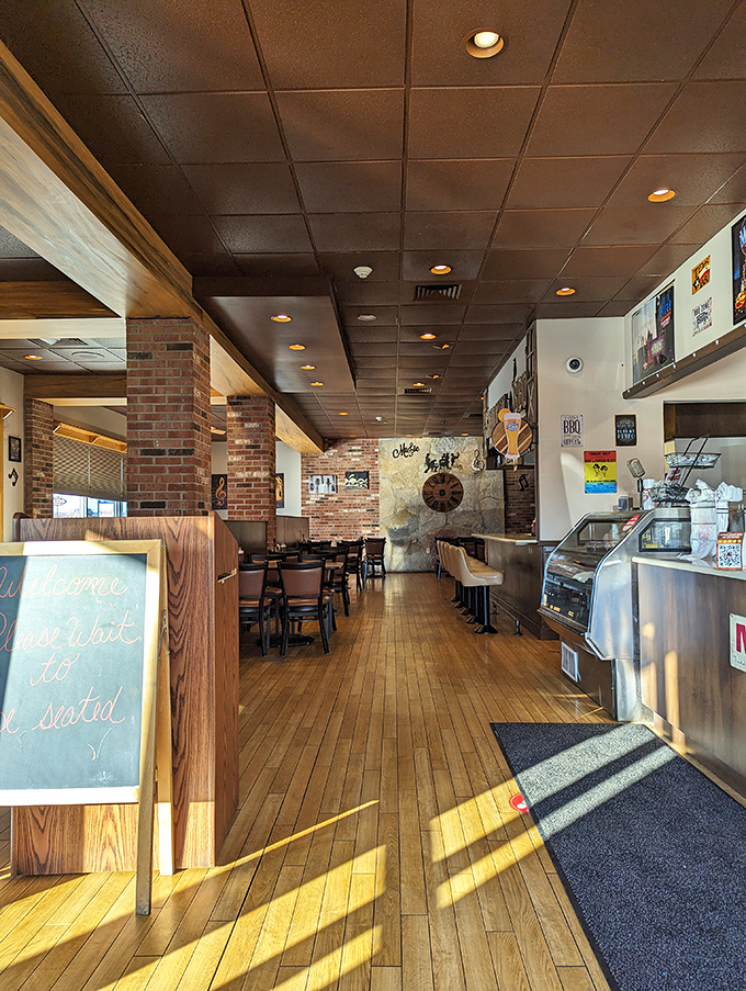 Wooden booths, brick columns, and the promise of smoky delights &ndash; a barbecue trinity that never disappoints.