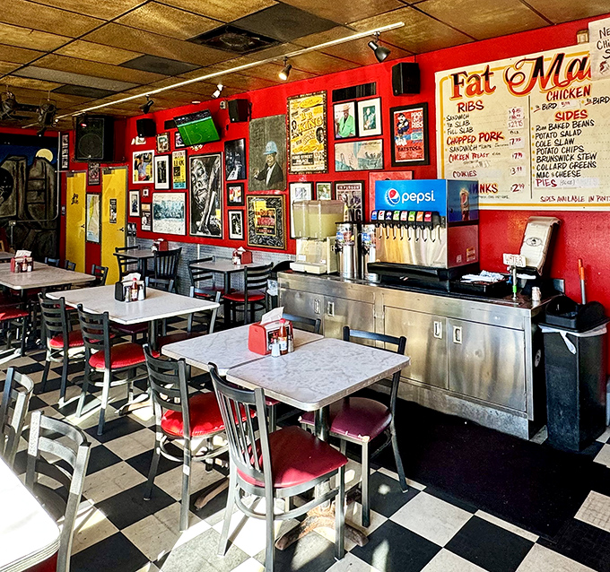 Red walls, checkered floors, and a menu board that says, "We've been doing this right for so long, we don't need to change a thing."