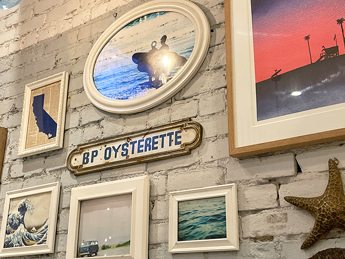 Coastal-themed art adorns white brick walls&mdash;a gallery of ocean appreciation that reminds you exactly where your dinner recently resided.