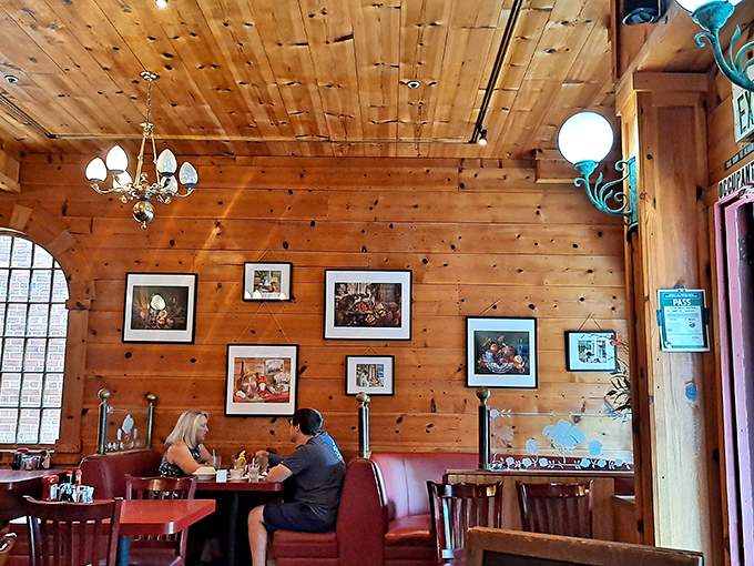 Knotty pine walls lined with framed memories create the perfect backdrop for conversations that flow as easily as the coffee refills.