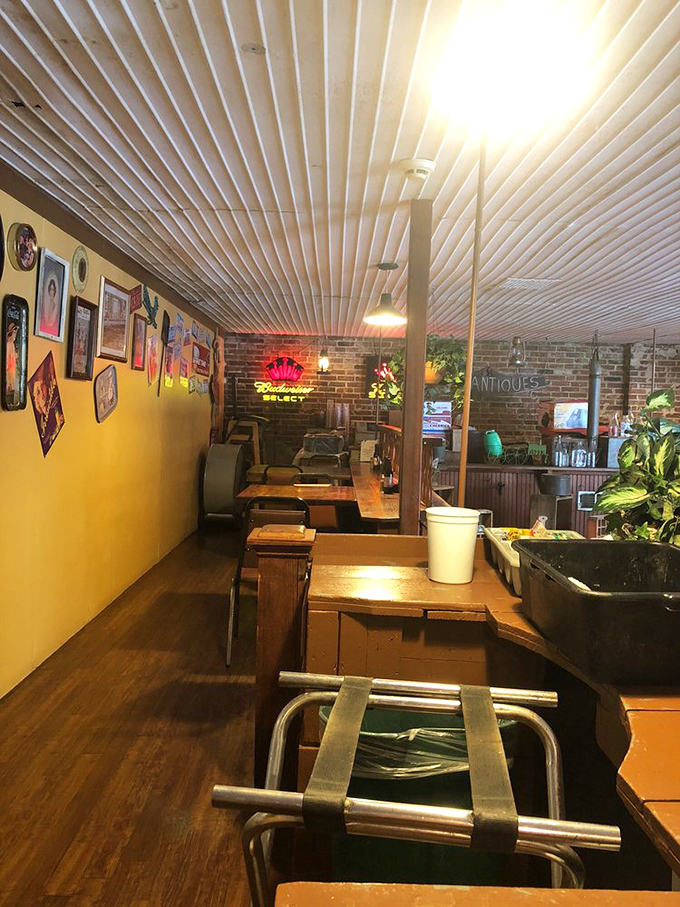 The bar area showcases decades of character, where every vintage sign tells its own delicious story.