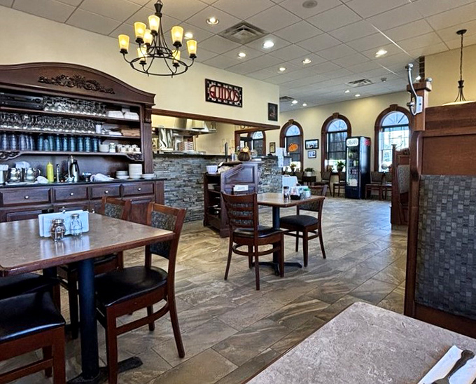 Warm wood tones, stone accents, and that chandelier &ndash; Guido's dining room feels like the Italian restaurant set designers create when they want to evoke "authentic charm."