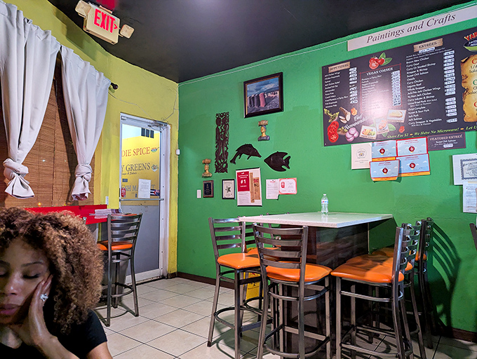 Green walls, orange chairs, and a vibe that says "stay awhile." Island hospitality doesn't need fancy furnishings to feel authentic.