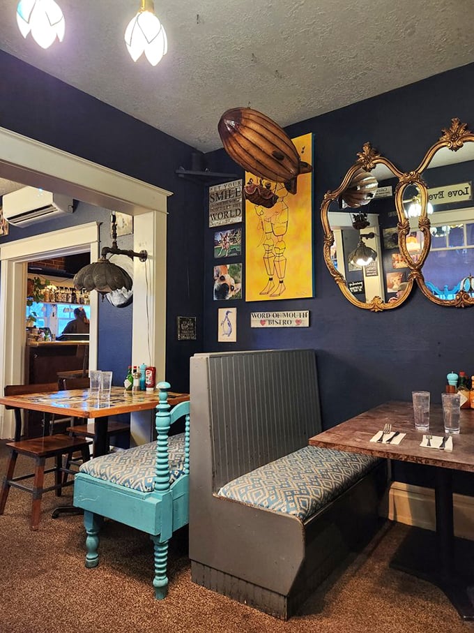 Vintage mirrors reflect what might be Salem's most cheerful dining room, where turquoise accents pop against navy walls like morning optimism.