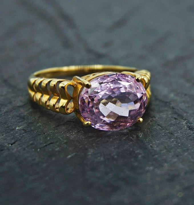 Sometimes the real treasure isn't the furniture but the jewelry case, where this gold and amethyst ring awaits its next chapter.
