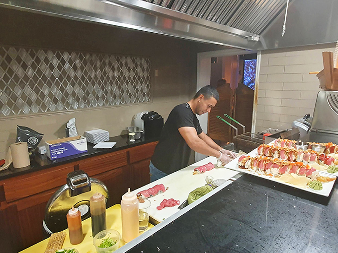 Behind the scenes, culinary magic happens as fresh seafood transforms into memorable meals under skilled hands that move with practiced precision.