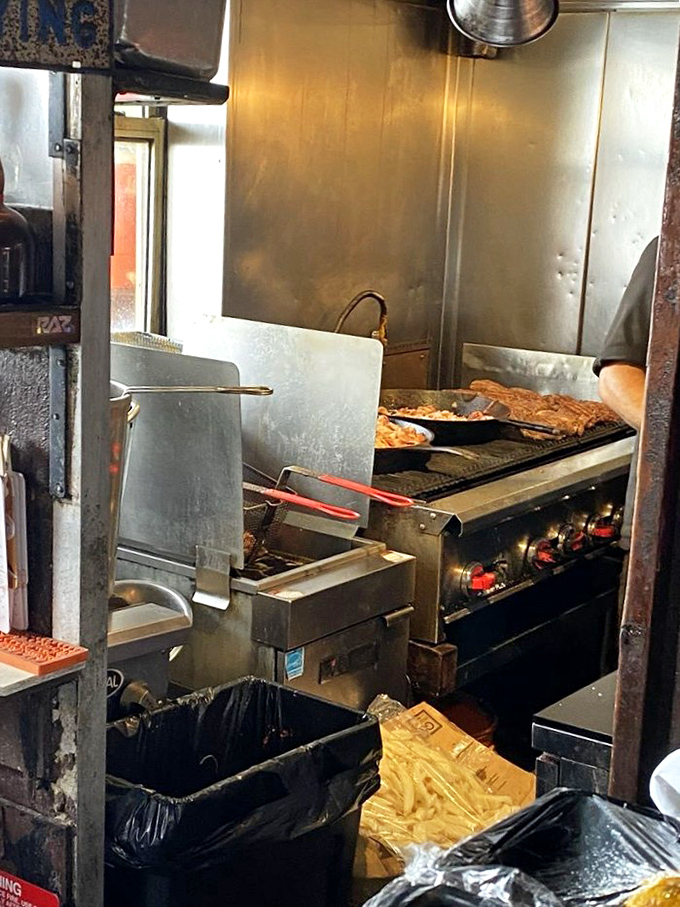 Behind the scenes, serious cooking happens in a kitchen that prioritizes flavor over fancy presentation every single time.