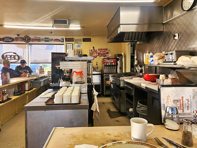 The kitchen&mdash;command central for comfort food operations. No molecular gastronomy happening here, just the beautiful choreography of short-order cooking.