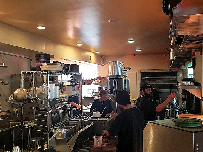 Where the magic happens &ndash; the kitchen team orchestrates a symphony of smoke and fire that transforms tough cuts into tender treasures.