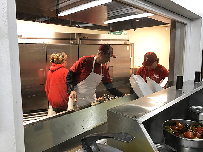 The kitchen crew works their magic behind the scenes. Like sandwich surgeons, their hands move with practiced precision honed over decades.