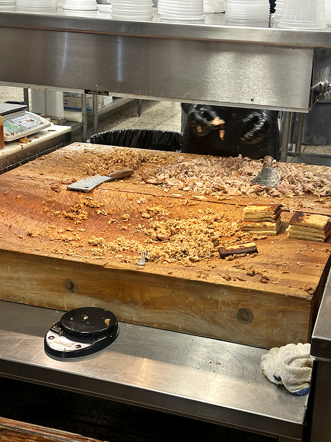 Where the magic happens. Those cleavers aren't for show&mdash;they're creating the perfect chop that makes Skylight Inn legendary.