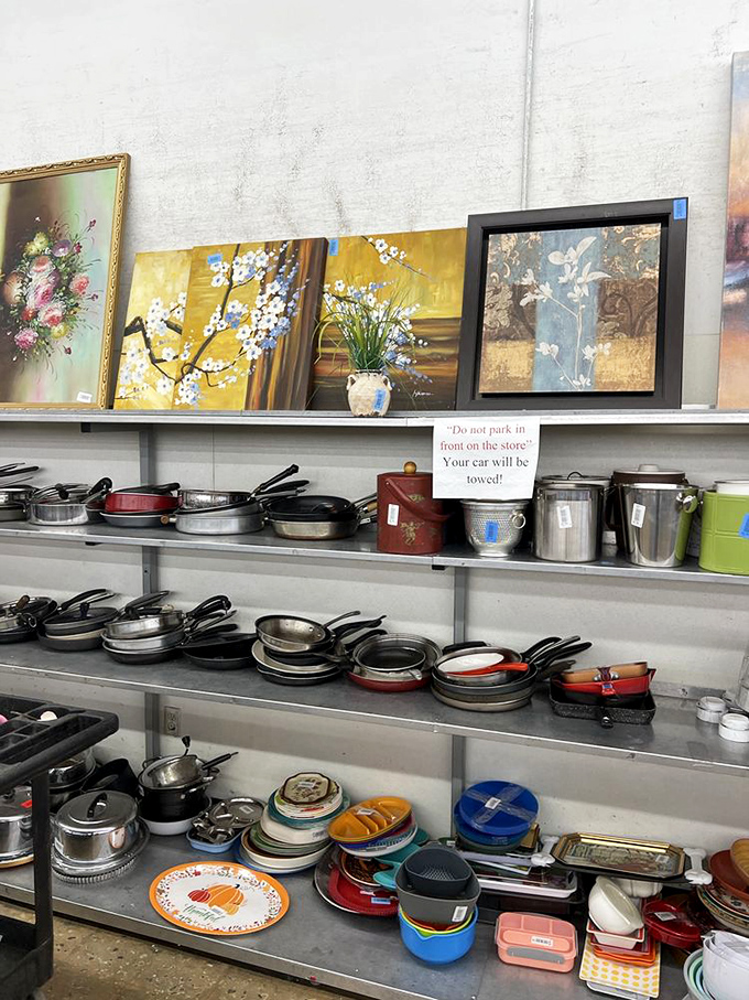 The kitchenware section &ndash; where cast iron pans with decades of seasoning wait alongside forgotten wedding registry items still sporting original stickers.