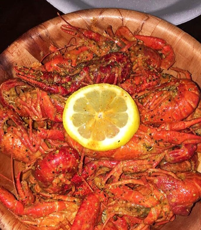 These crawfish, arranged like a spicy sunburst around a lemon moon, aren't just food&mdash;they're edible art with attitude.