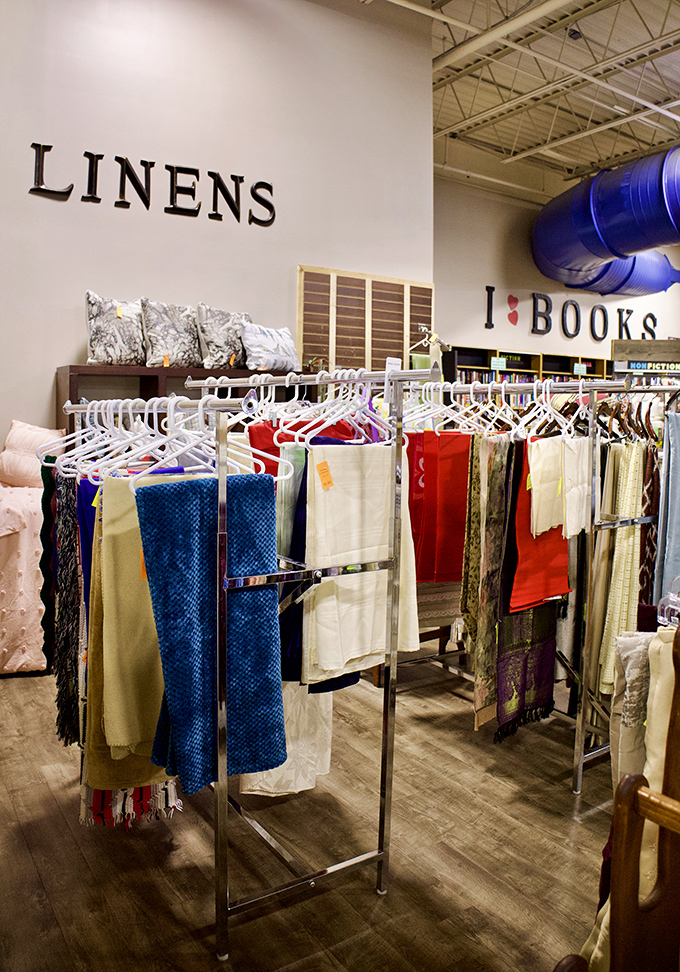 Linens department: where tablecloths with stories to tell hang alongside pristine bedding that's barely seen a night's sleep.