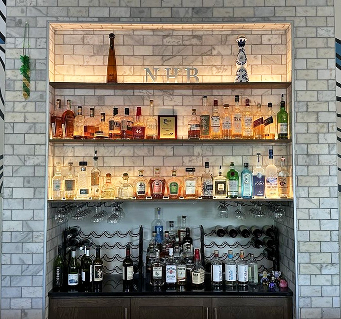 A backlit altar to spirits that would make even non-drinkers pause in reverence. Those bottles aren't just alcohol; they're liquid possibilities.