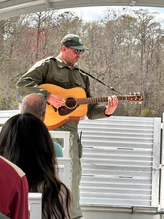 Wilderness troubadour: park rangers often share Florida's natural heritage through music, turning boat tours into floating concerts beneath the cypress canopy.