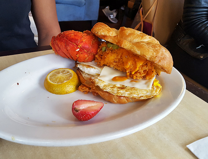 This sandwich defies gravity and good manners. The fried chicken, egg, and cheese demand to be eaten with both hands and zero dignity.