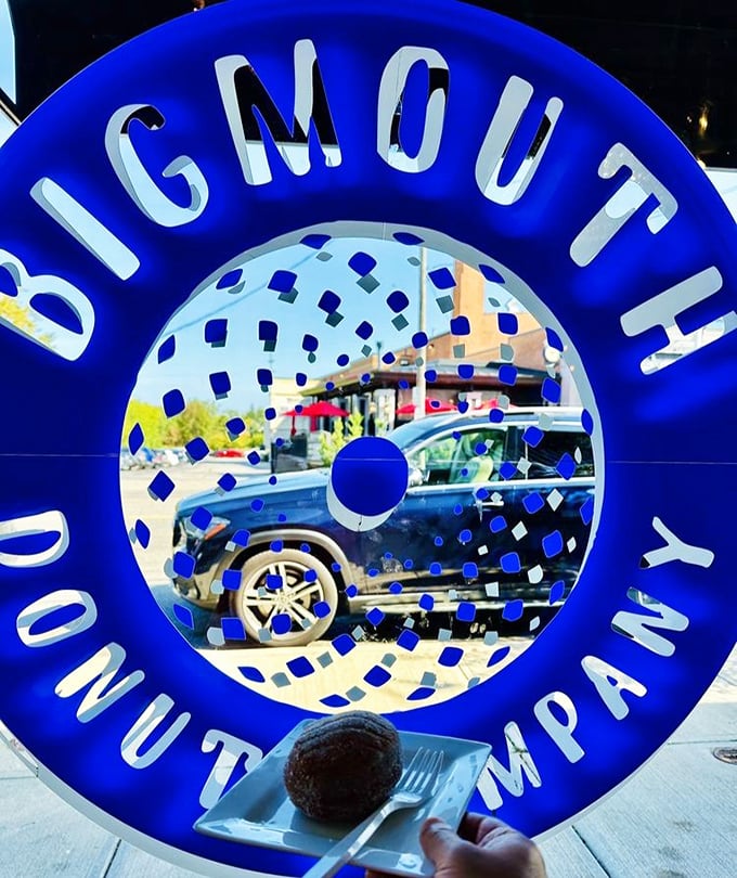 The blue neon logo glows like a portal to another dimension&mdash;one where calories don't count and joy is measured in sprinkles.