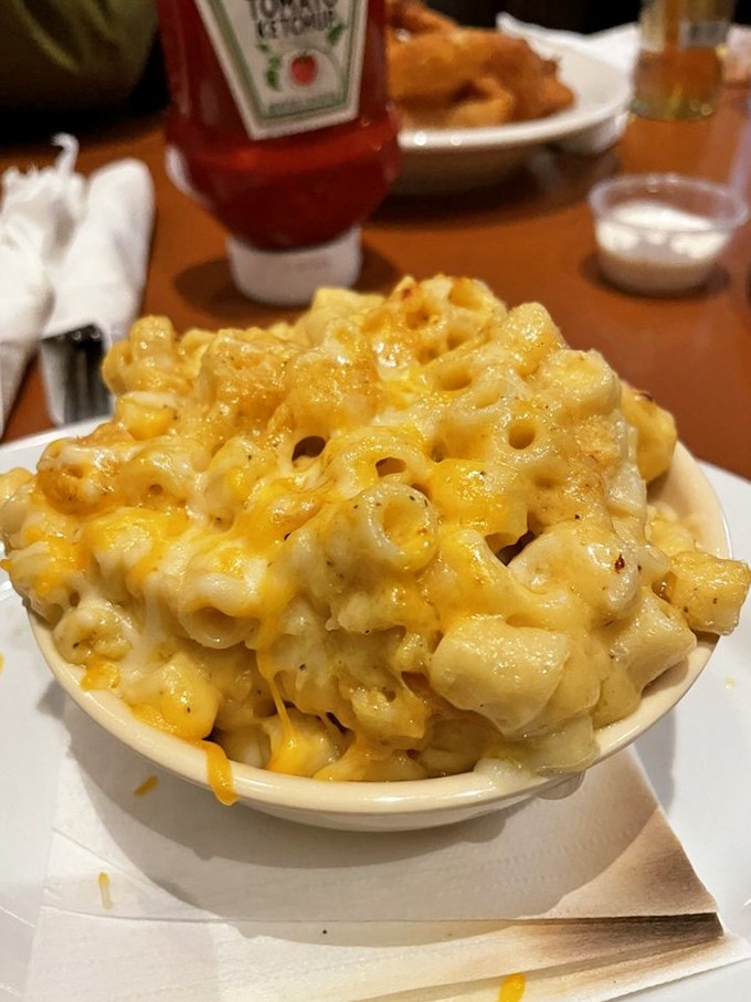 This isn't just mac and cheese—it's a molten masterpiece of dairy devotion that would make even the most sophisticated palate surrender.