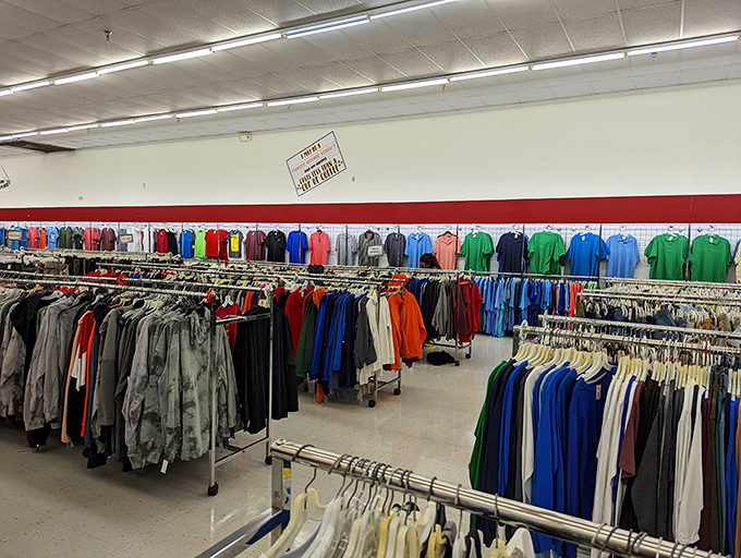 Men's shirts and jackets hang like colorful soldiers at attention. That mint green pullover might become someone's new favorite weekend staple.