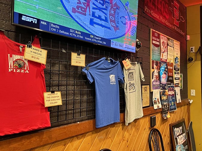 Merch on display – because sometimes wearing the t-shirt is the only way to prove to friends back home that yes, the pizza was that good.