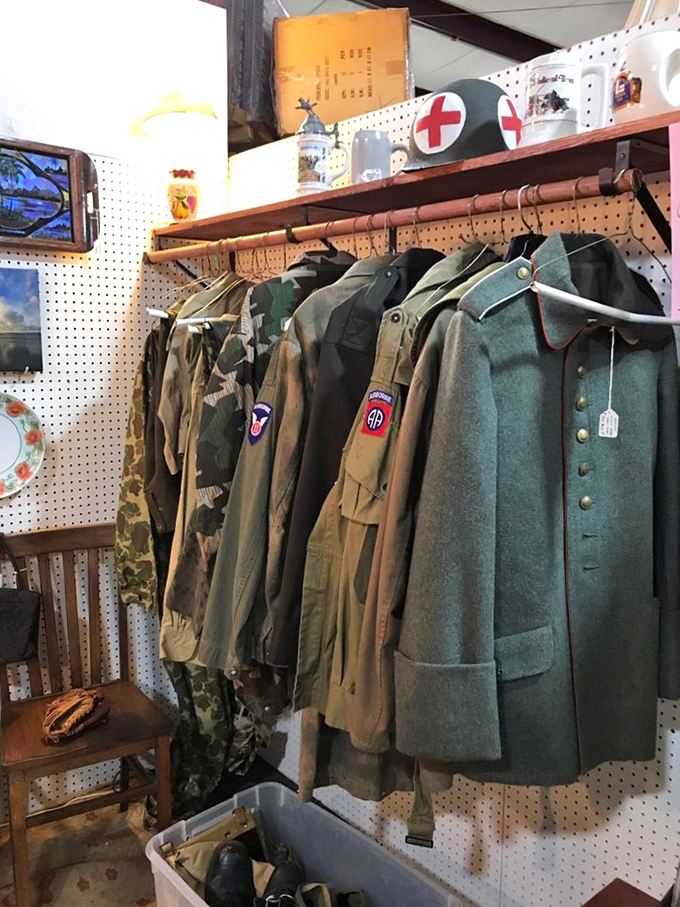 Military uniforms stand at attention, patches telling stories of service and sacrifice. Each jacket represents someone's father, brother, or grandfather who answered the call.