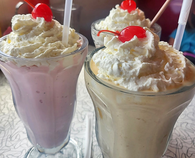 Milkshakes so thick they laugh in the face of gravity. That whipped cream and cherry combo is the tiara on dessert royalty.