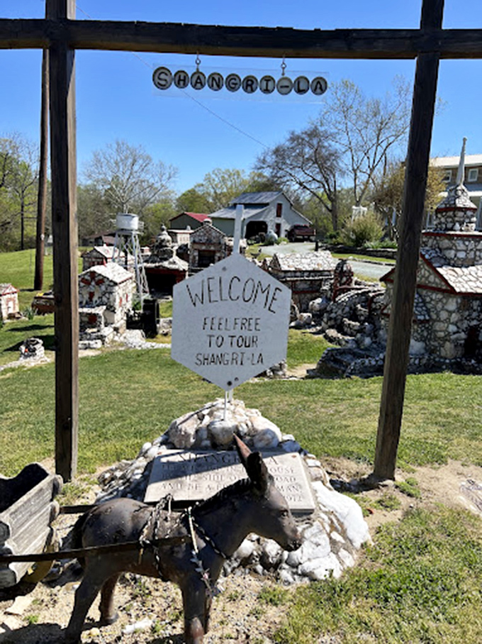 "Welcome" says the sign, and who wouldn't feel invited into this charming miniature world? The stone donkey stands ready to give tours to mouse-sized visitors.